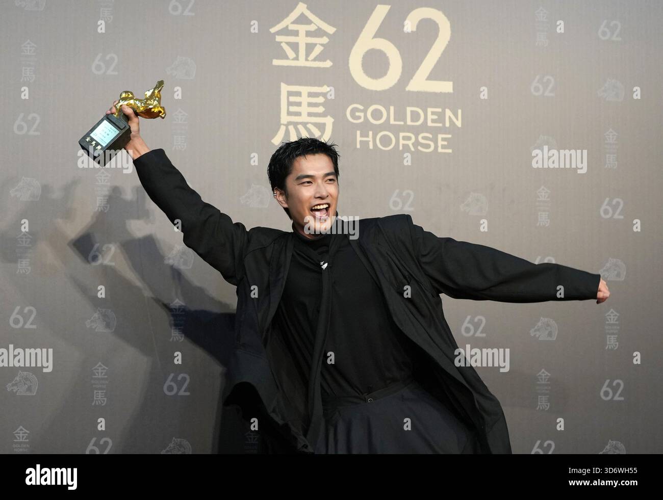 Tseng Jing-hua holds his award for Best Supporting Actor for the film "Family Matters" at the ...