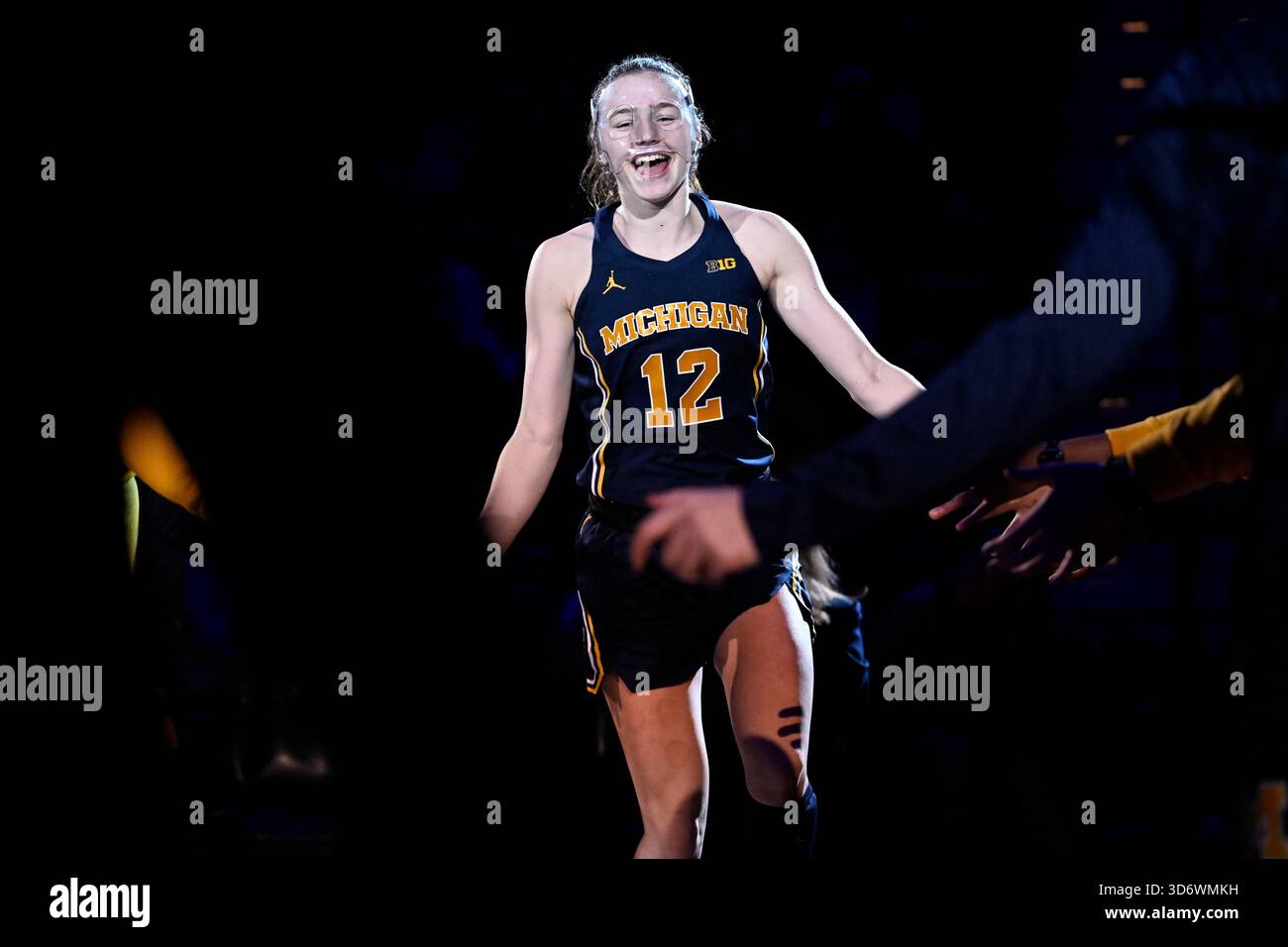 Michigan guard Syla Swords (12) is introduced in an NCAA college ...