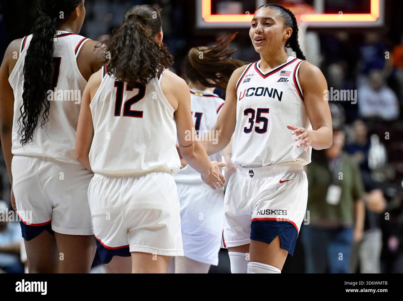 UConn guard Azzi Fudd (35) smiles toward teammates after defeating ...