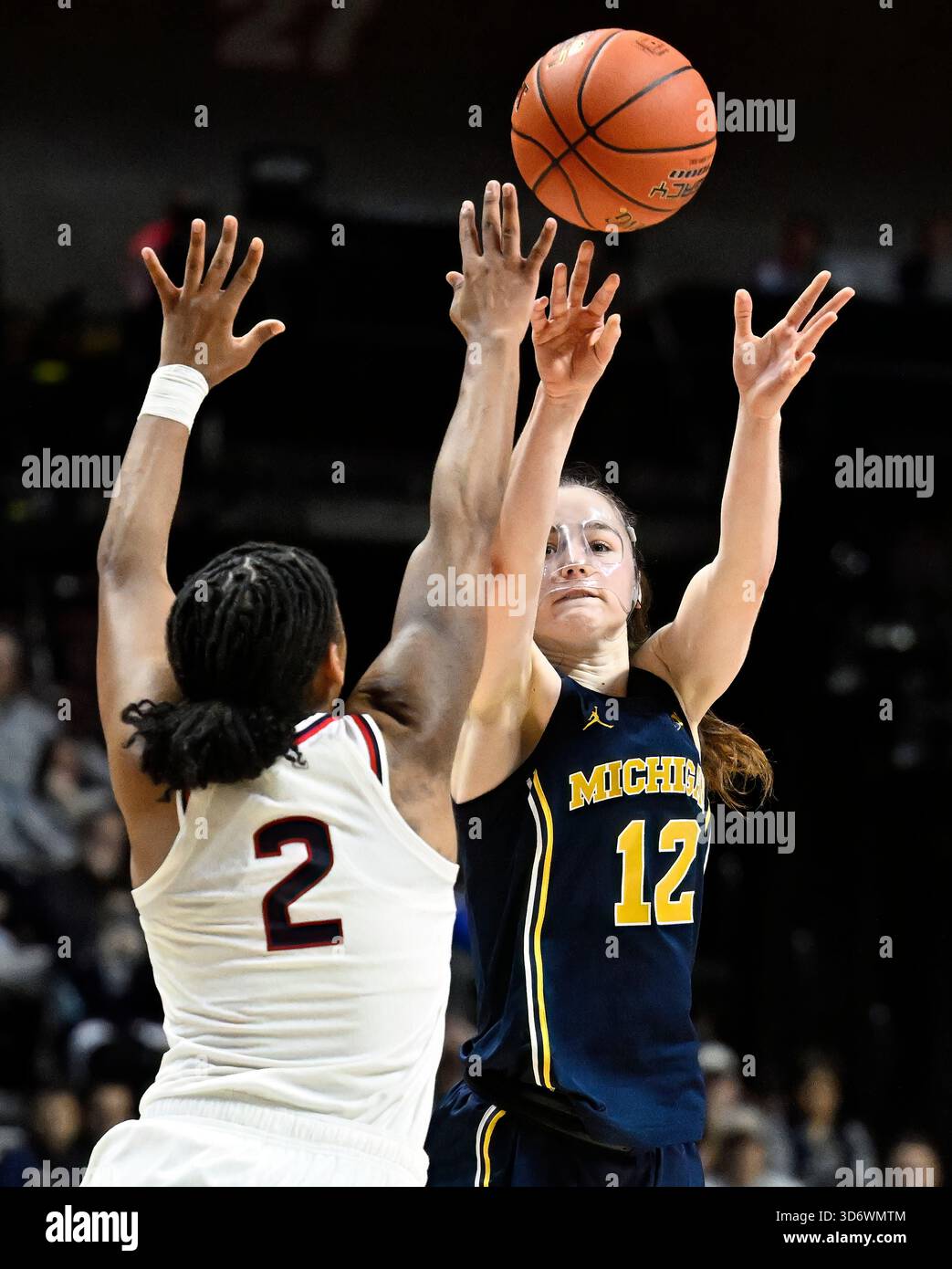 Michigan guard Syla Swords (12) shoots over UConn guard KK Arnold (2 ...