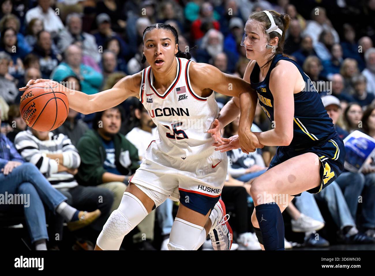 UConn guard Azzi Fudd (35) is guarded by Michigan guard Syla Swords (12 ...