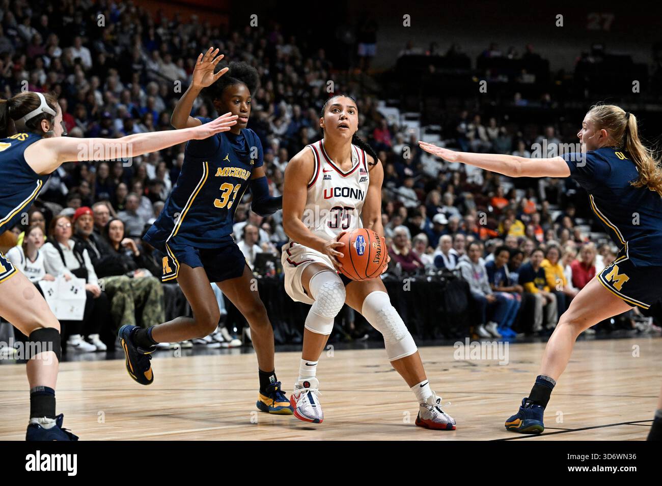 UConn guard Azzi Fudd (35) looks to shoot against Michigan in the first ...