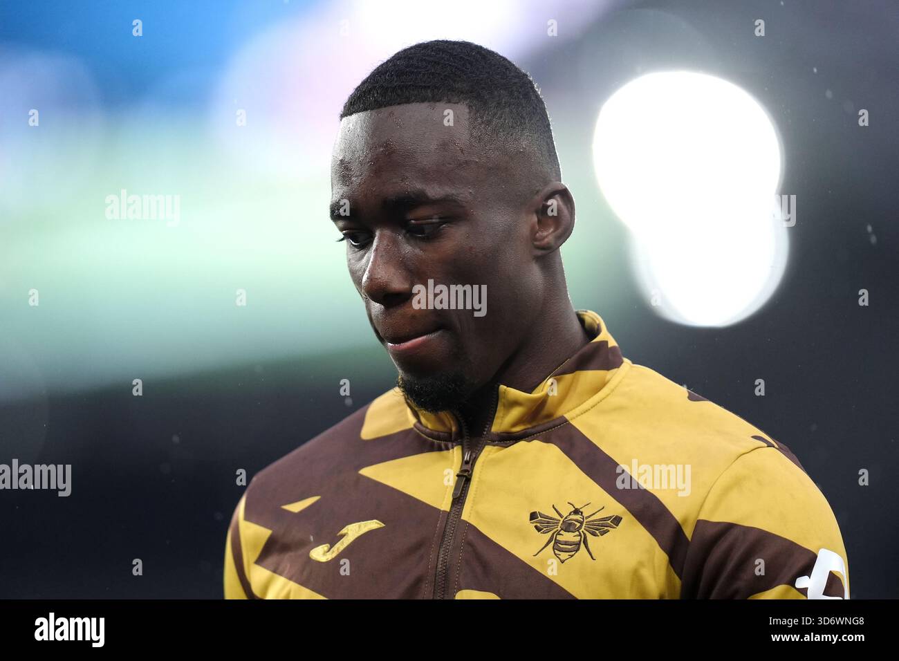 Brentford's Michael Kayode warming up prior to kick-off before the ...