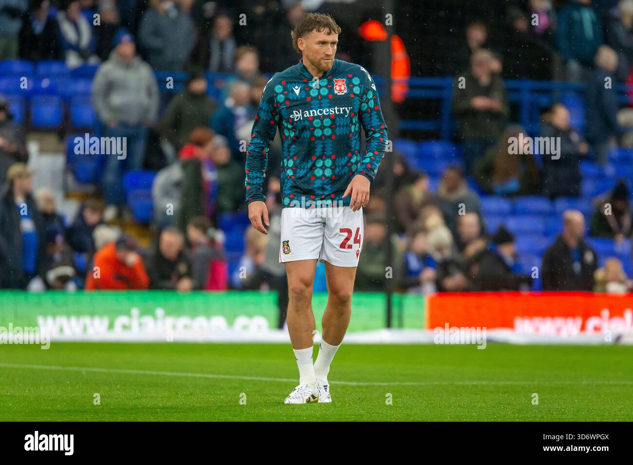 Dan Scarr of Wrexham warming up before the Sky Bet Championship match ...
