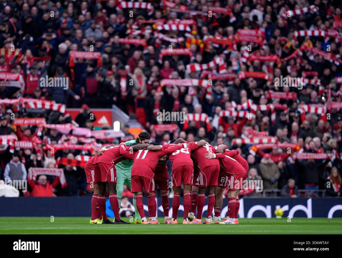 Liverpool players in a group huddle before the Premier League match at ...