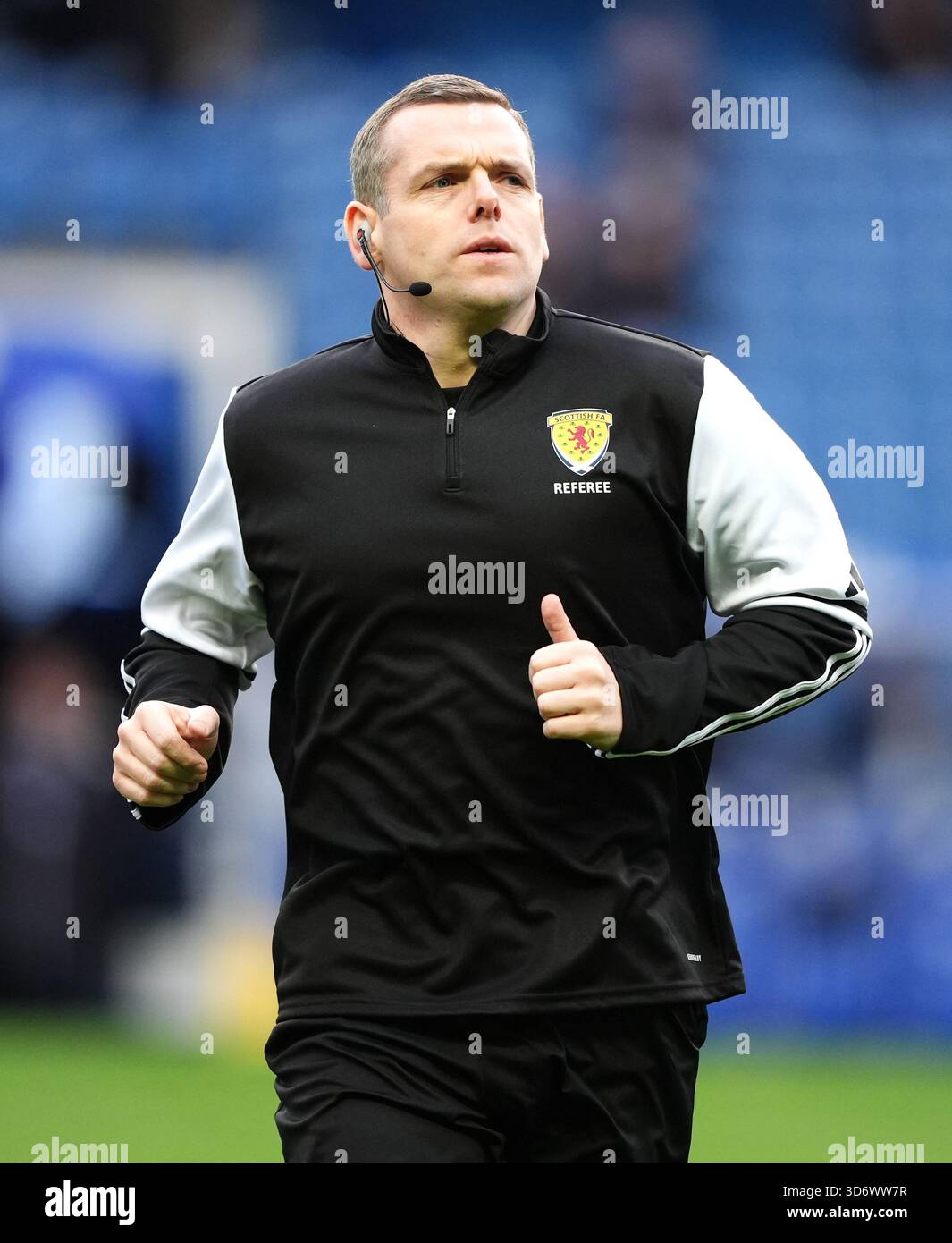 Match official Douglas Ross warming up prior to kick-off in the William ...
