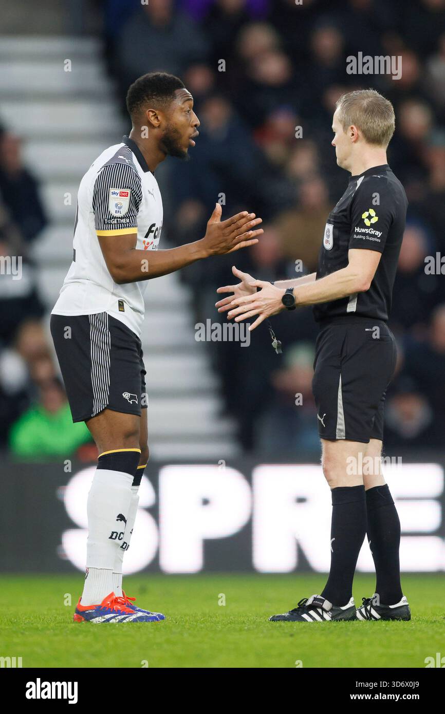 Derby County's Ebou Adams with referee Gavin Ward (right) during the ...