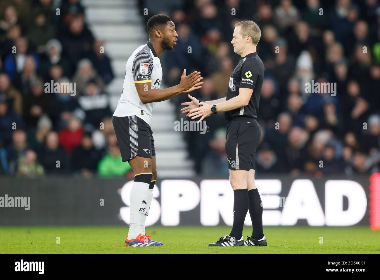 Derby County's Ebou Adams with referee Gavin Ward (right) during the ...