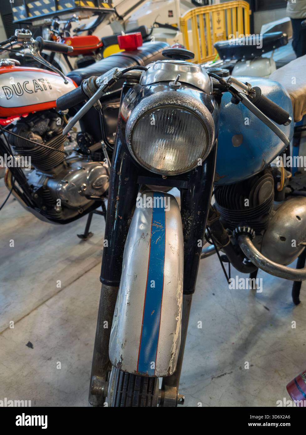 Closeup of a classic motorcycle front section featuring a round ...