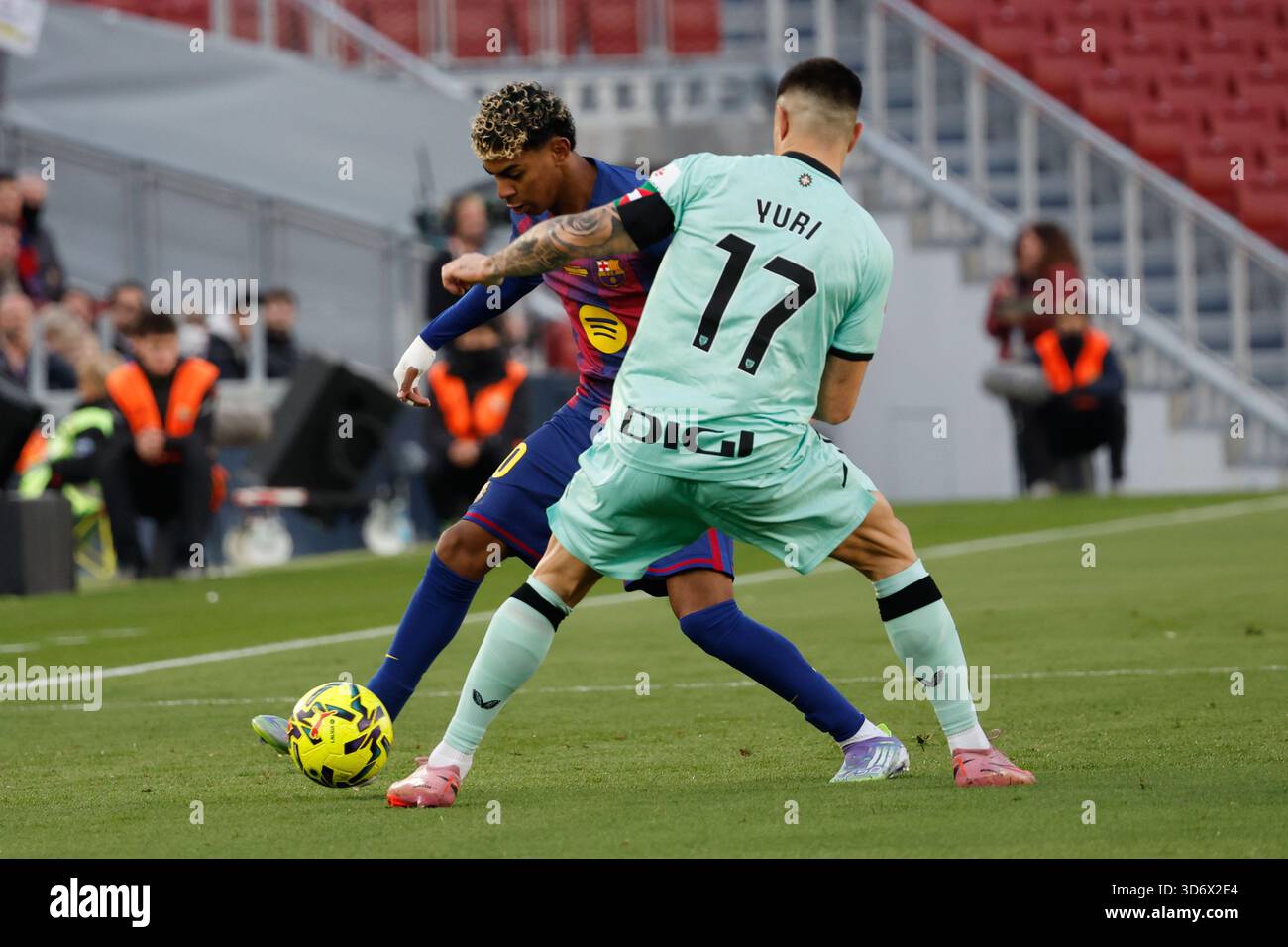 Barcelona's Lamine Yamal, left, and Athletic Bilbao's Yuri Berchiche ...