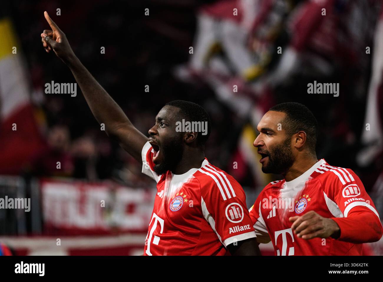 Bayern's Dayot Upamecano and Bayern's Jonathan Tah, right, celebrate ...