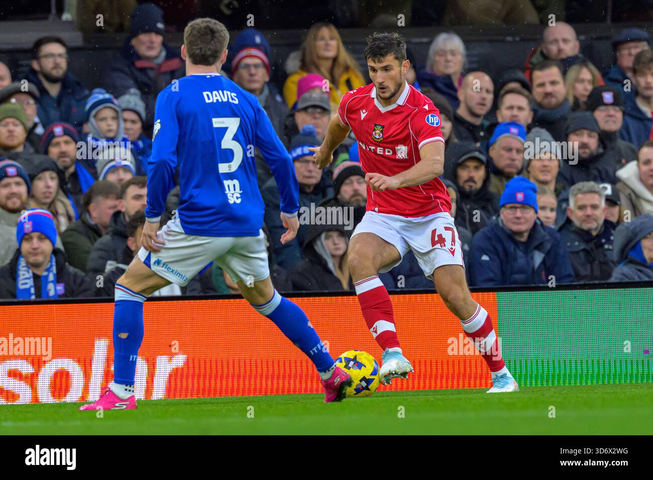 Ryan Longman (47 Wrexham AFC) under pressure from Leif Davis (3 Ipswich ...
