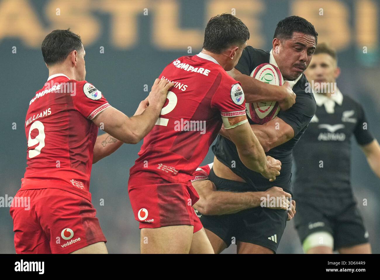 New Zealand's Anton Lienert-Brown, right, is tackled by Wales' Joe ...