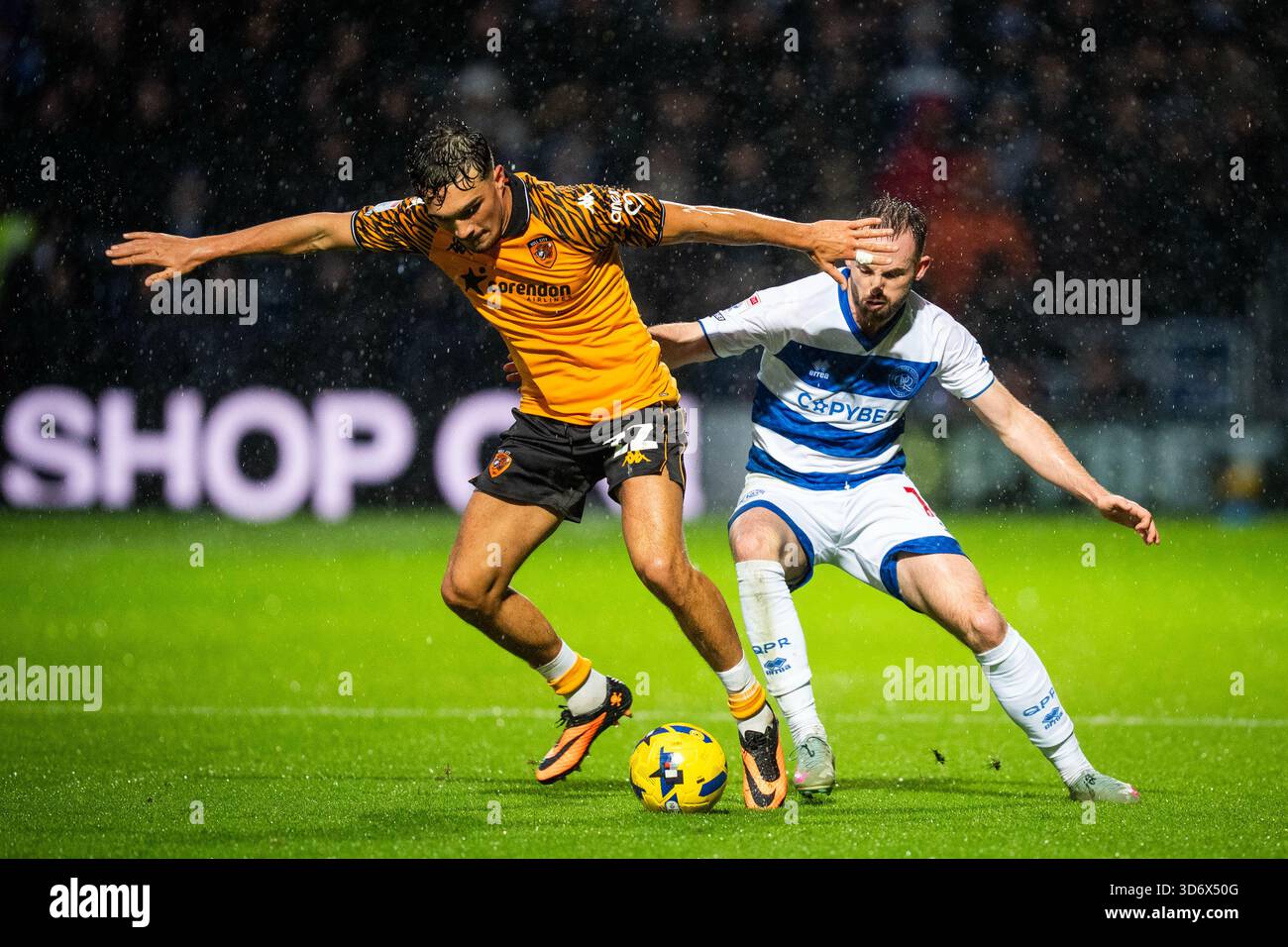 Hull City's Kyle Joseph (left) and QPR's Rhys Norrington-Davies during ...