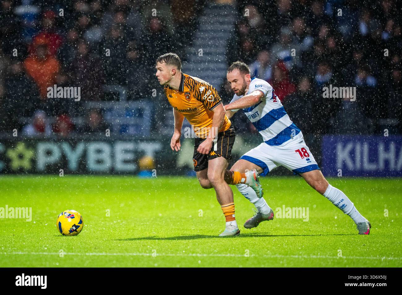 QPR's Rhys Norrington-Davies (right) chases down Hull City's Joe ...