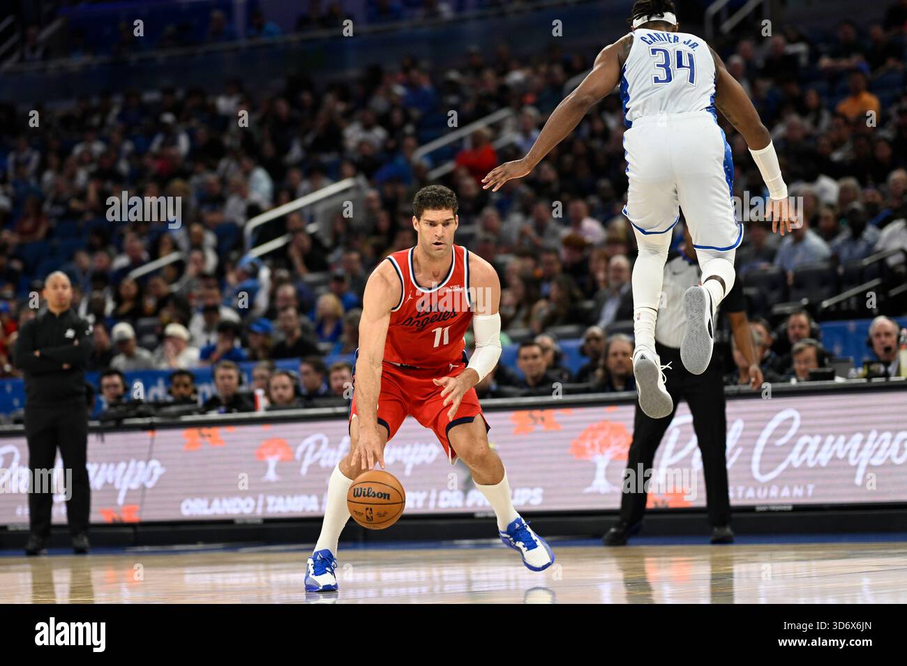 Los Angeles Clippers center Brook Lopez (11) is defended by Orlando ...