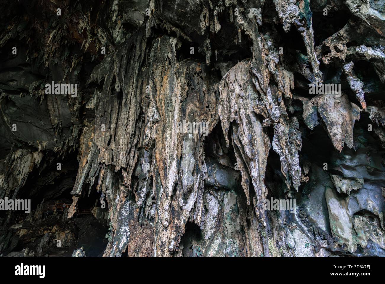 Stalactites and mineral rock formations hanging from a natural cave ...