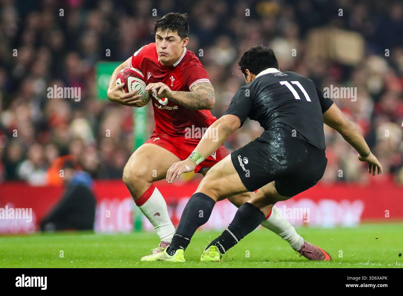 Louis Rees-Zammit of Wales takes on Caleb Clarke of New Zealand during ...