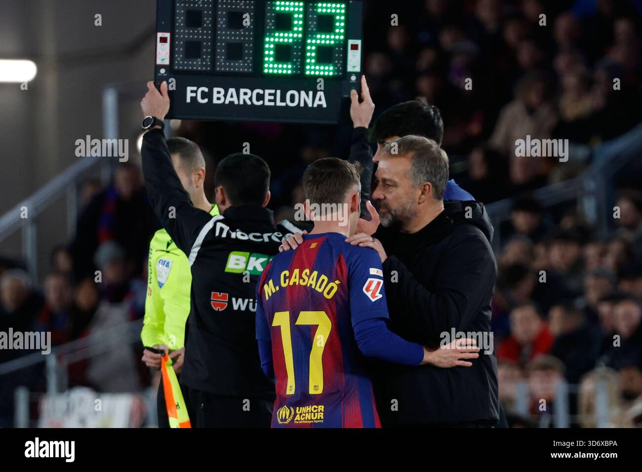 Barcelona's head coach Hansi Flick talks to Marc Casadoduring a La Liga ...