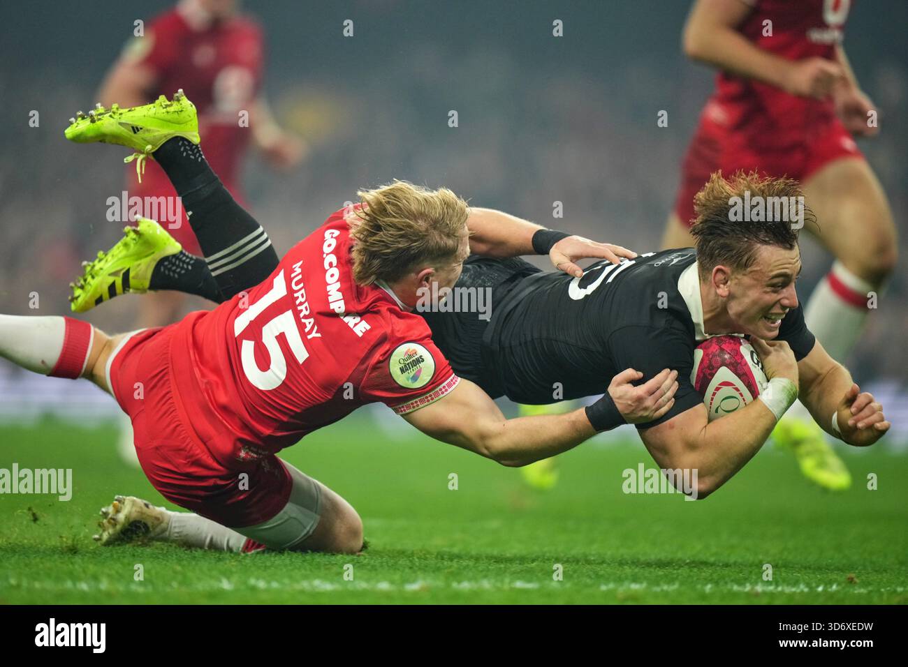 New Zealand's Ruben Love scores a try despite the challenge of Wales ...