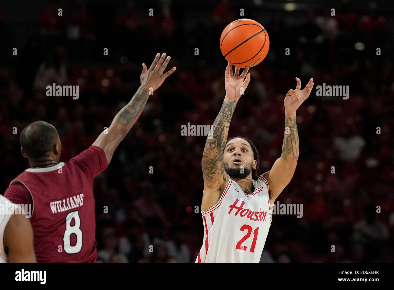 Houston guard Emanuel Sharp (21) shoots during the first half of an ...