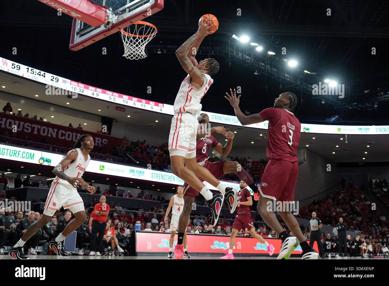 Houston center Chris Cenac Jr. (5) drives to the basket during the ...