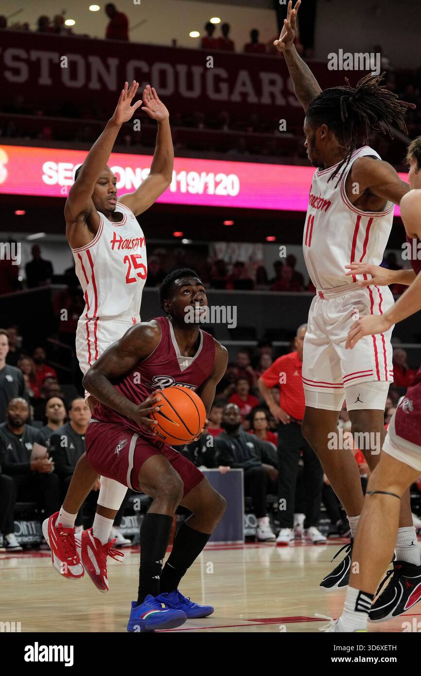 Rider guard Caleb Smith (2) is double-teamed by Houston guard Mercy ...
