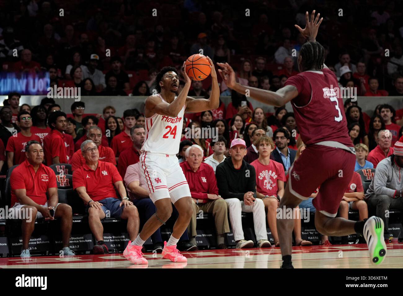 Houston forward Chase McCarty (24) pulls up for a three-pointer over ...