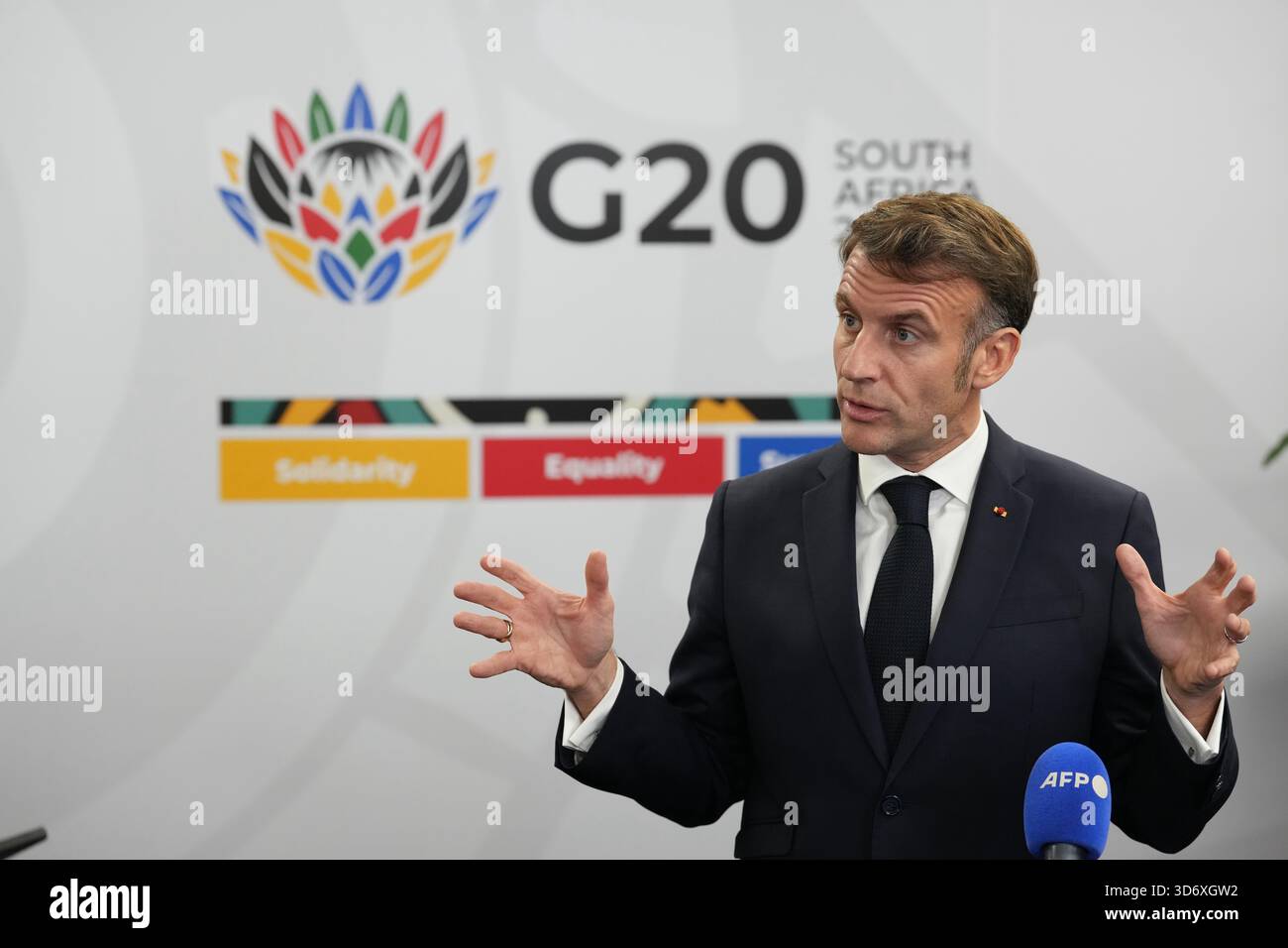 French President Emmanuel Macron speaks to the media at the end of the ...