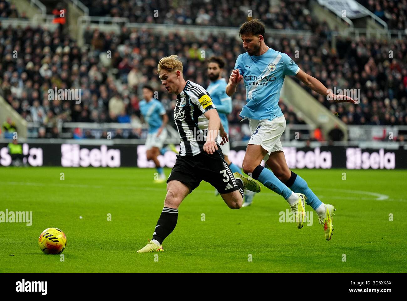 Newcastle United's Lewis Hall (left) is fouled by Manchester City's ...