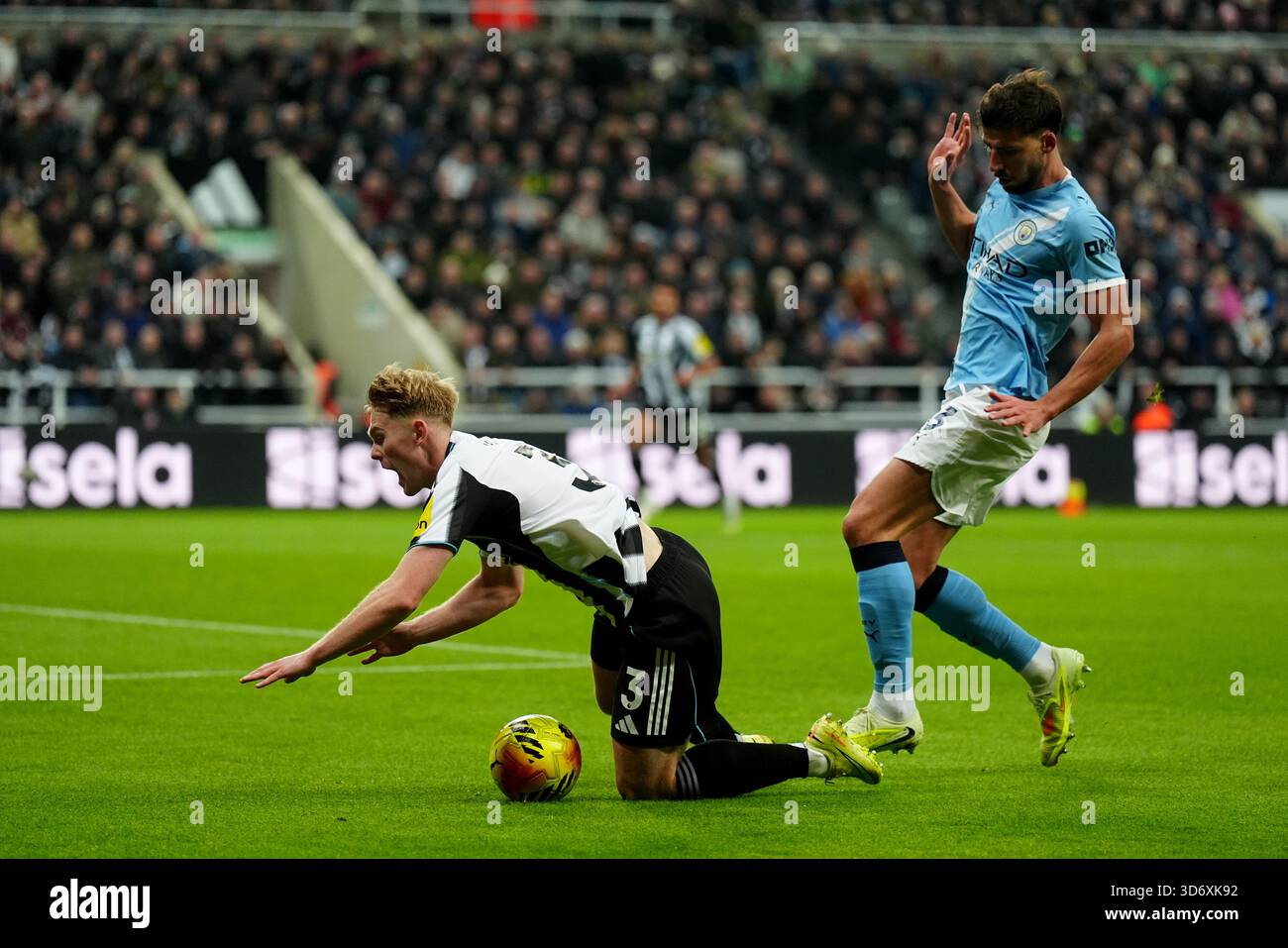 Newcastle United's Lewis Hall (left) is fouled by Manchester City's ...