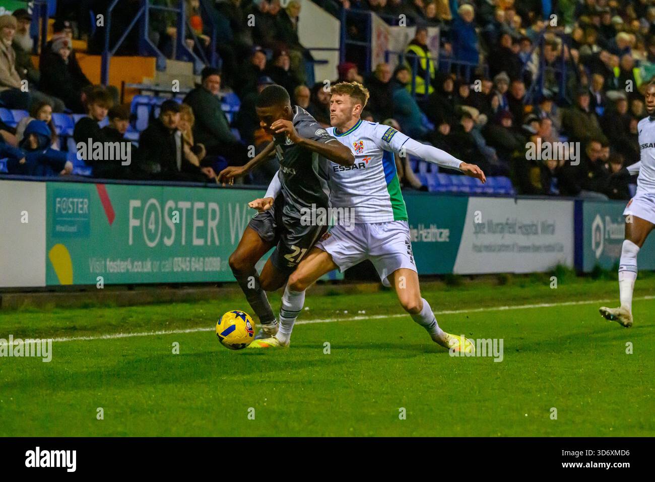 Patrick Brough of Tranmere Rovers FC tackles Marvin Ekpiteta of Milton ...