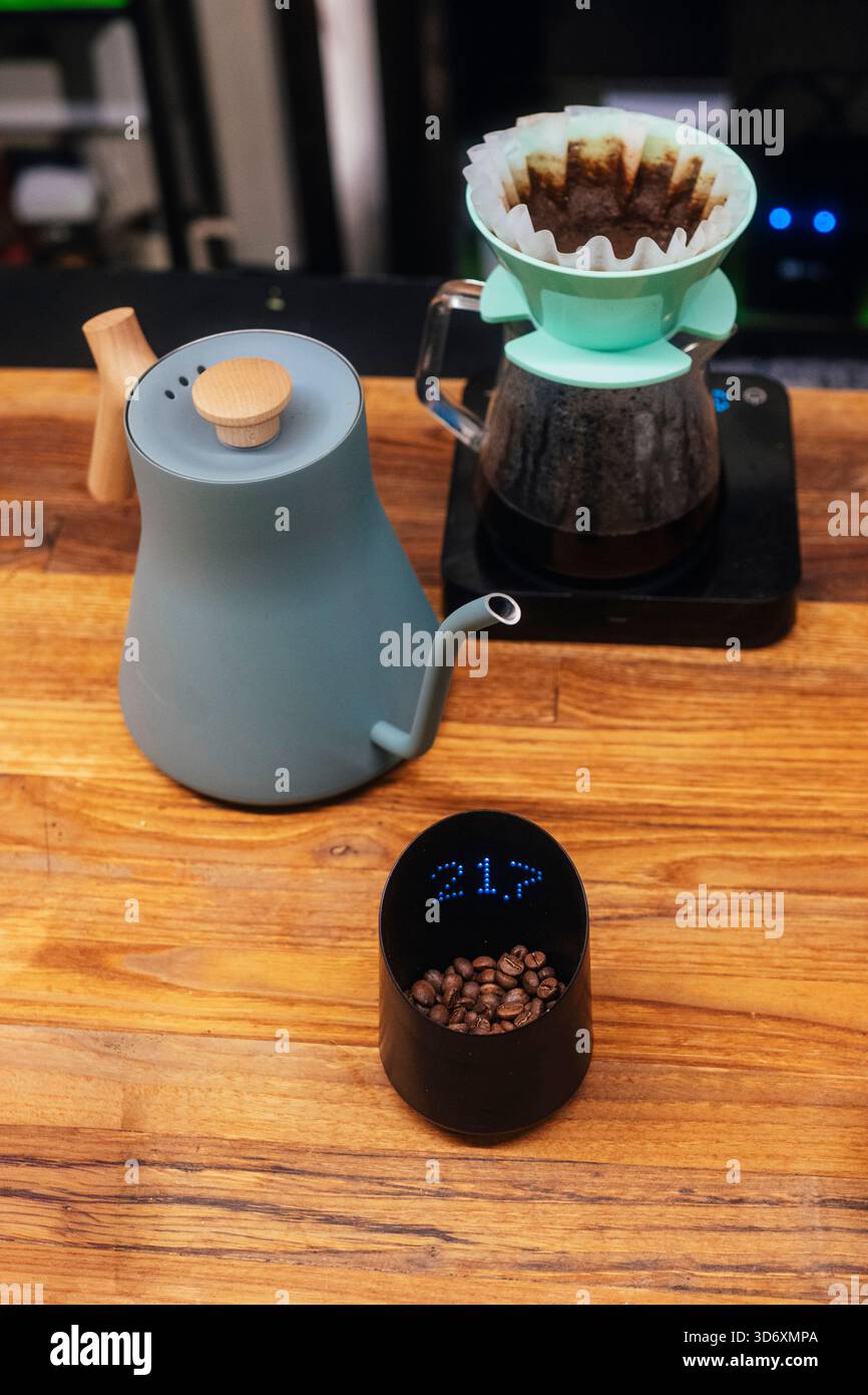 Pour-over coffee setup with kettle and dripper Stock Photo - Alamy