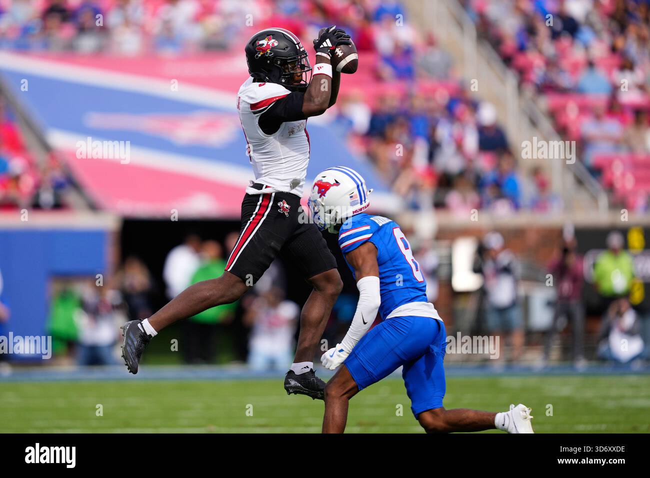 Louisville wide receiver Chris Bell catches a pass as SMU cornerback ...