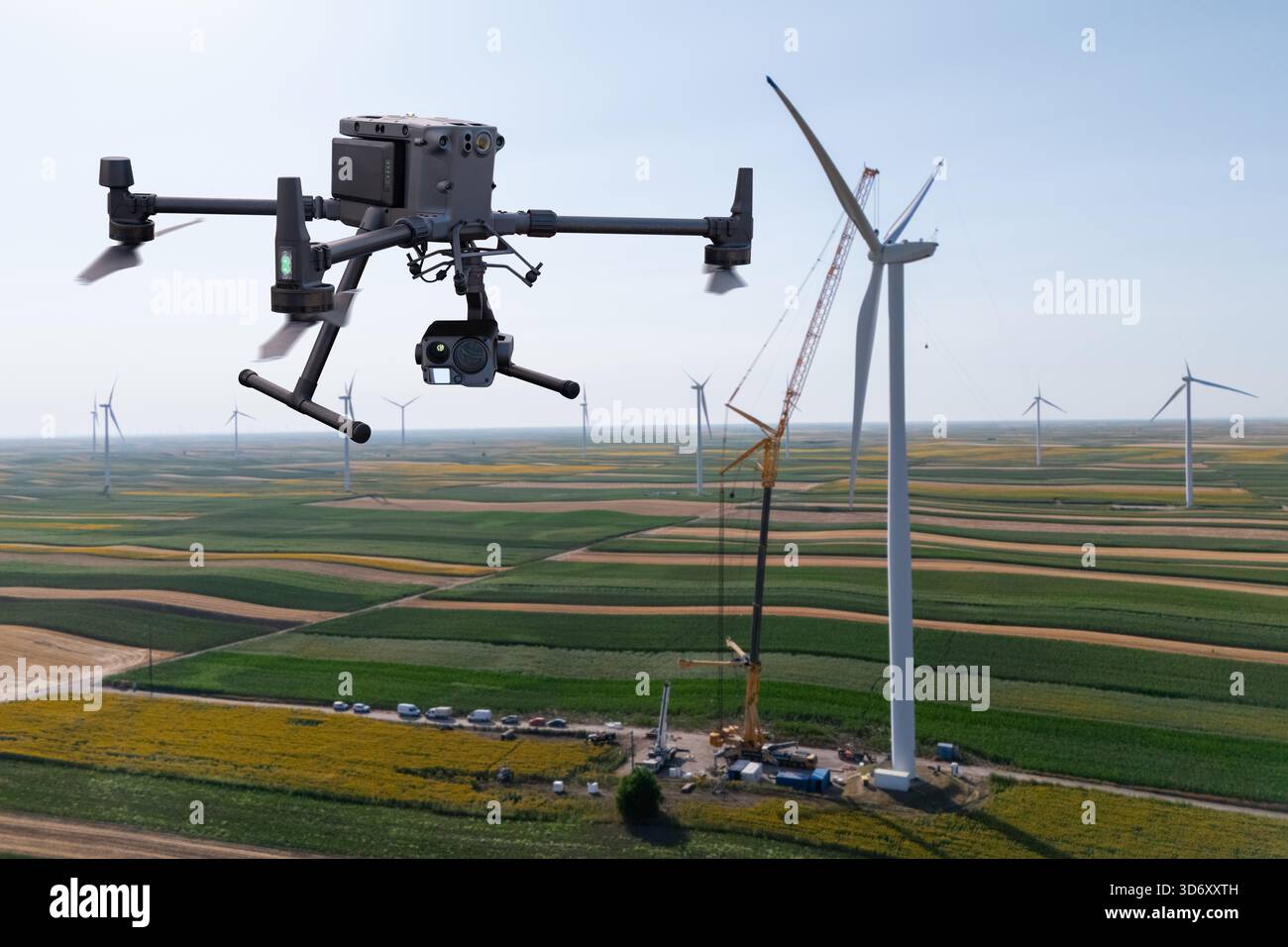 Drone controls wind turbine installation Stock Photo - Alamy