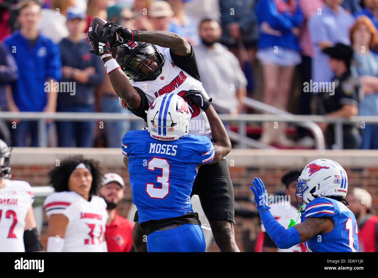 Louisville wide receiver Chris Bell (0) catches a pass as SMU safety ...