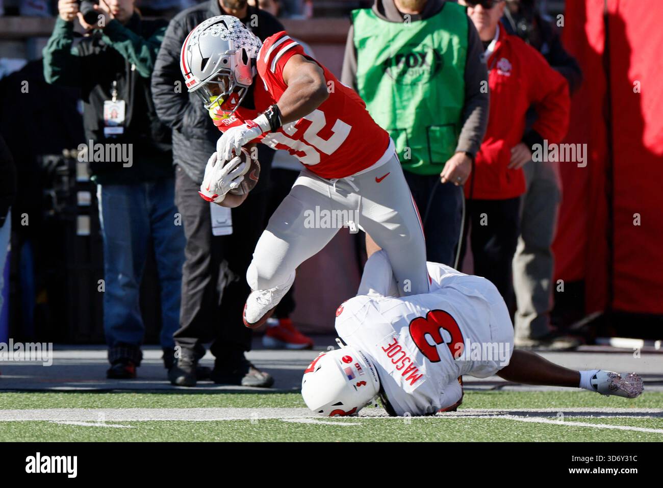 Rutgers defensive back Bo Mascoe, bottom, forces Ohio State running ...