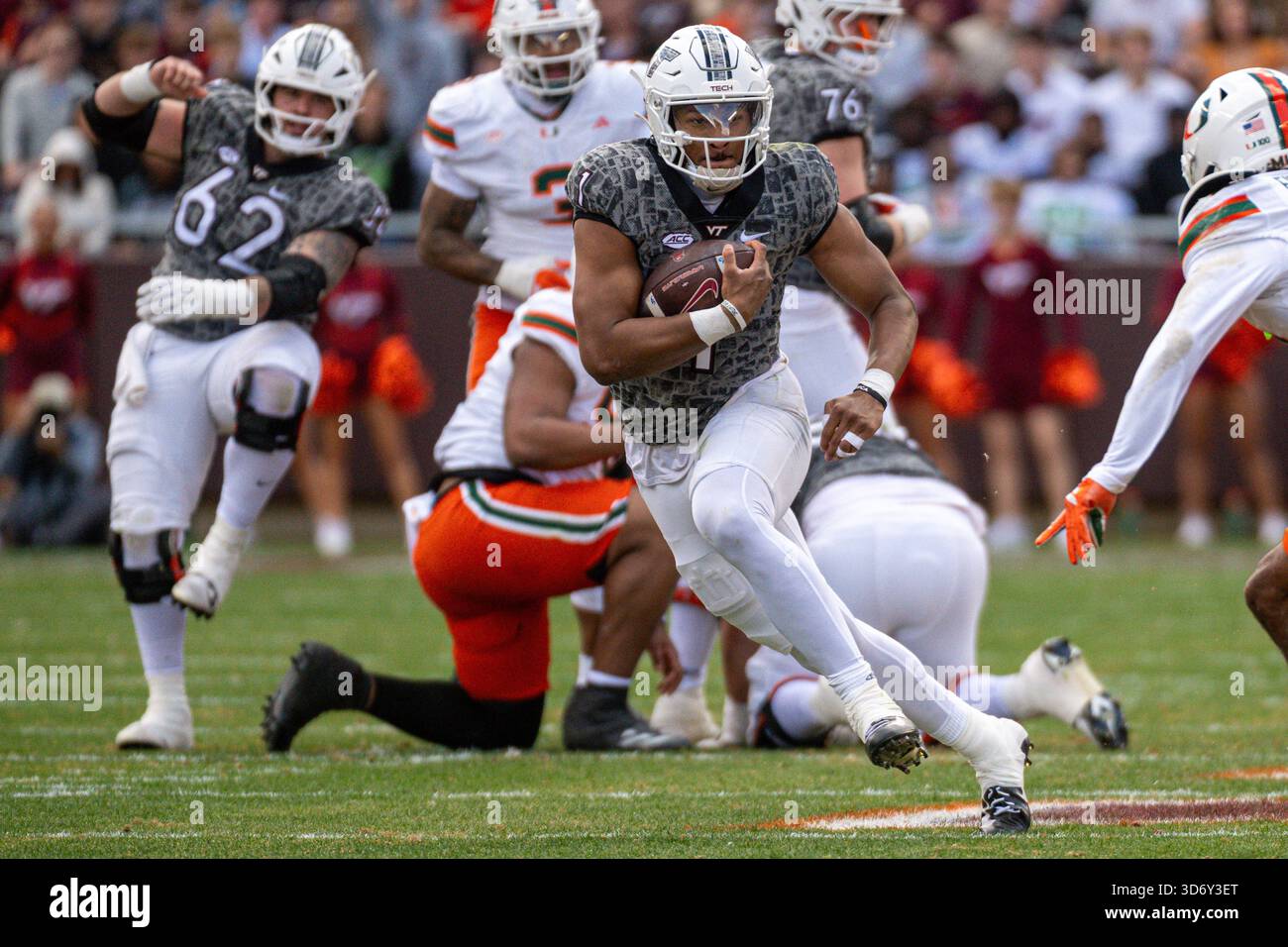 Virginia Tech quarterback Kyron Drones (1) runs for a first down ...