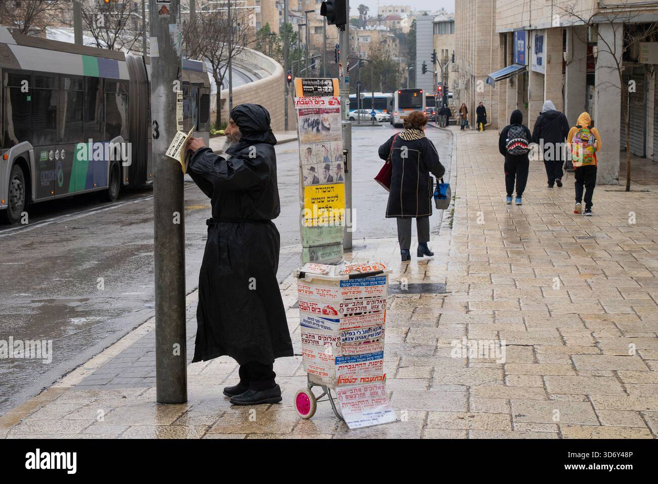 Jerusalem, Israel - February 10th, 2025:A Jewish orthodox man , posting ...