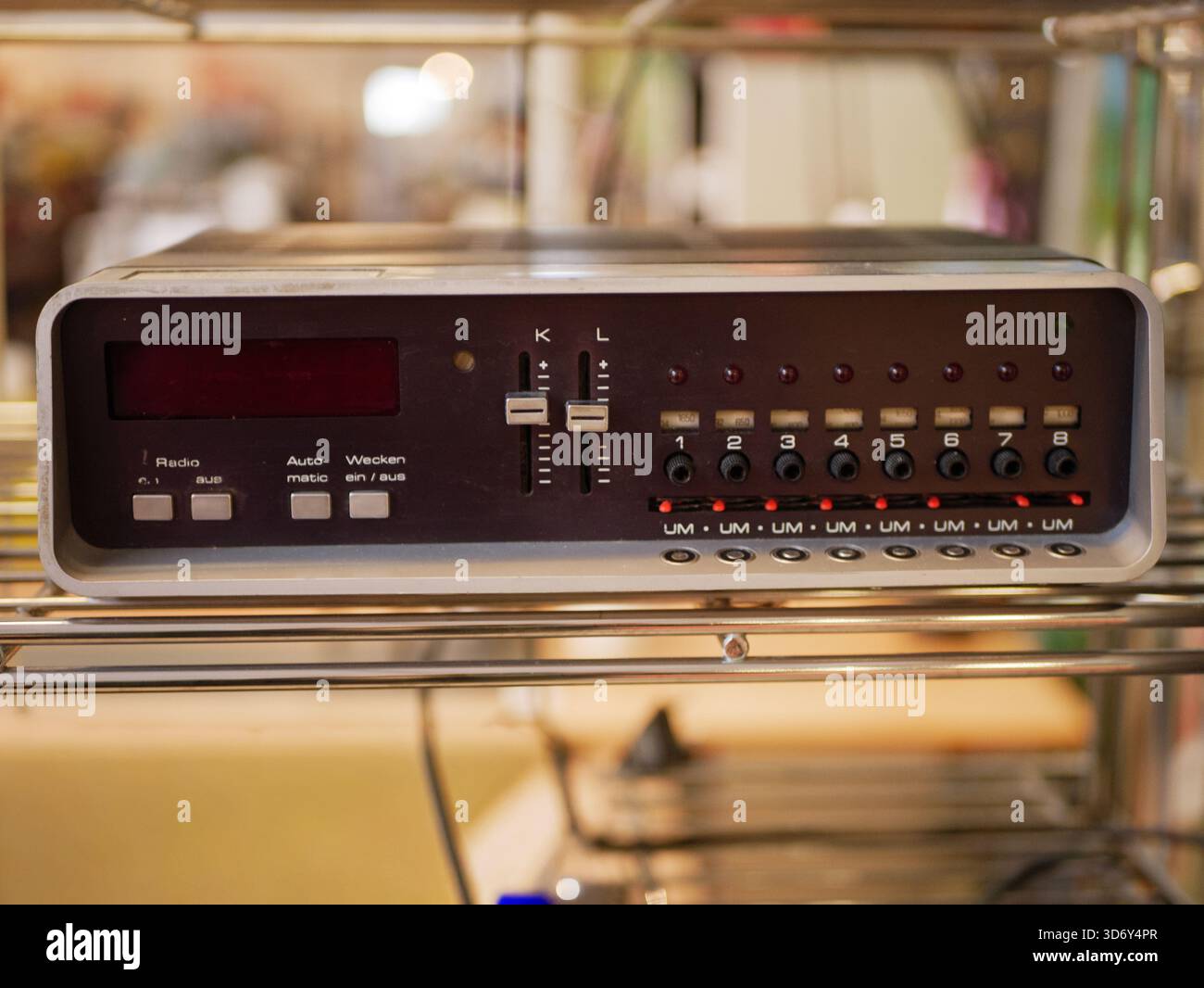 A retro electronic control panel with multiple switches, buttons, and ...