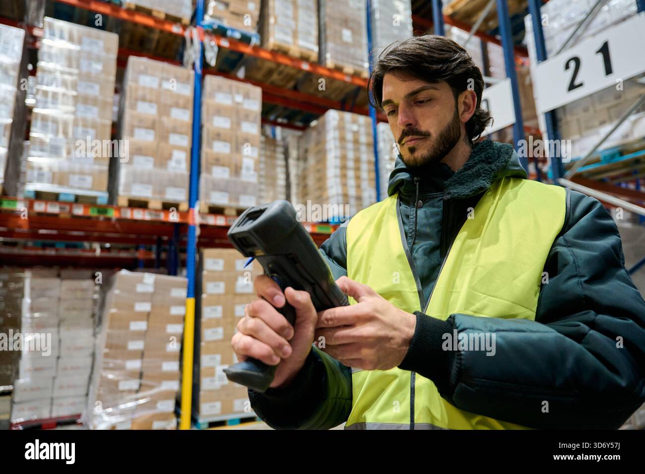 Warehouse worker scanning inventory in cold chain storage Stock Photo ...