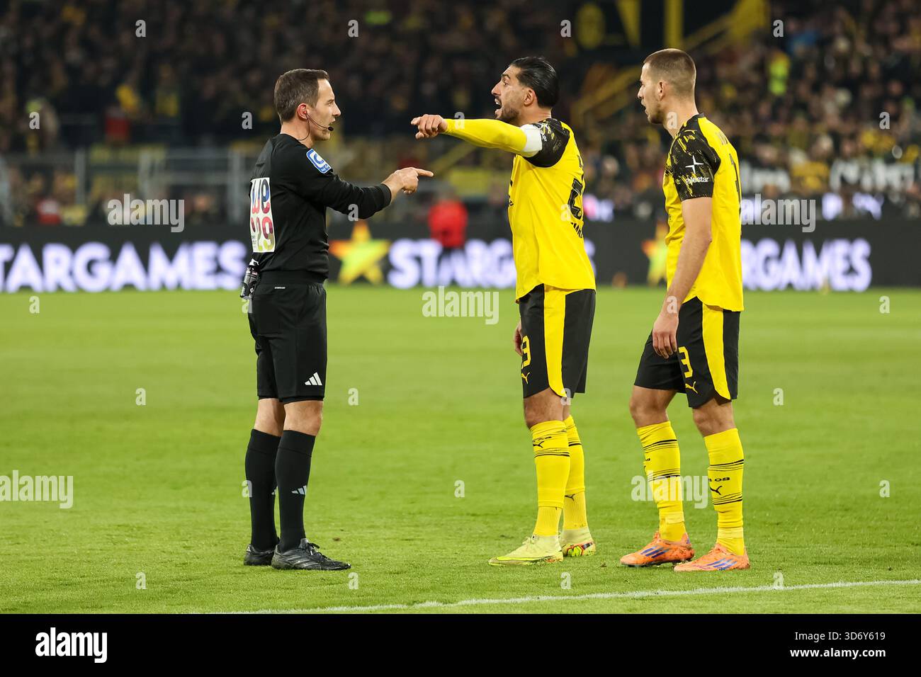 Emre Can (Borussia Dortmund) with referee Benjamin Brand GER, Borussia ...