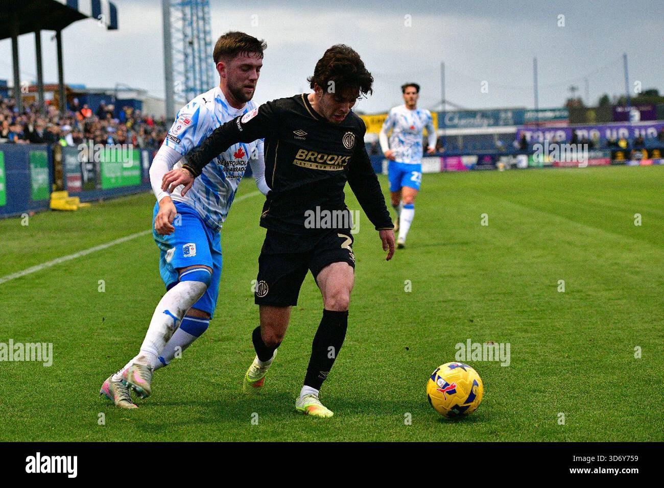 Barrow's Ben Jackson in action with Cambridge United's McConnell during ...
