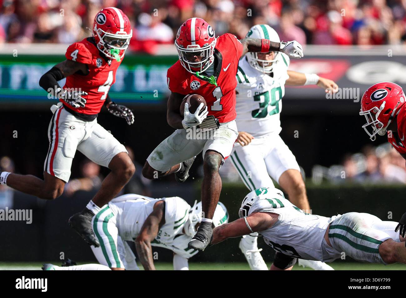 Georgia wide receiver Zachariah Branch (1) jumps over Charlotte ...