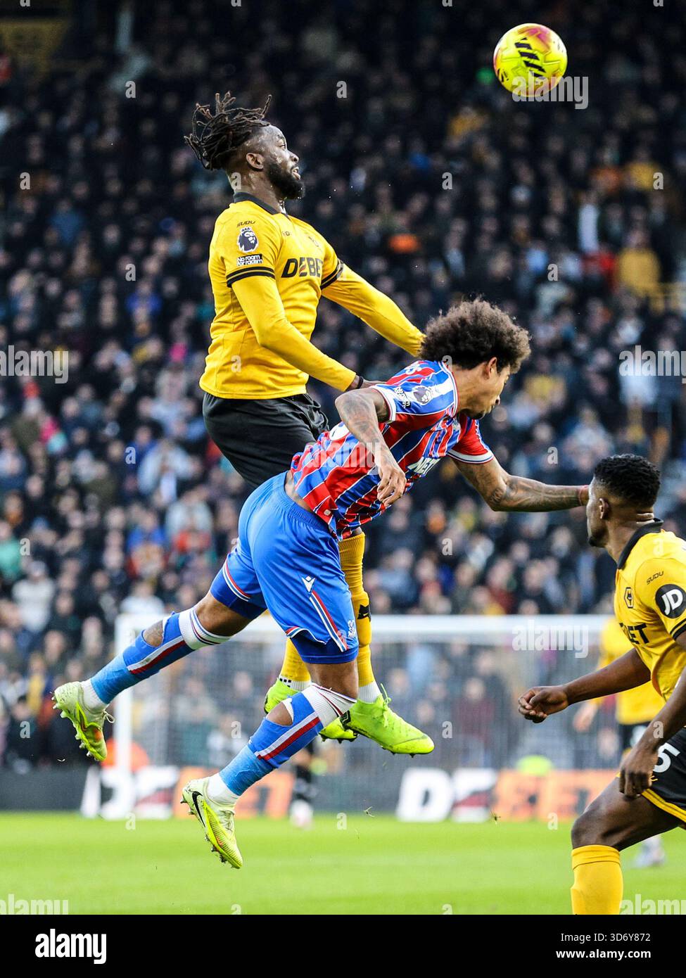 Tolu Arokodare (14 Wolves) heads the ball during the Premier League ...
