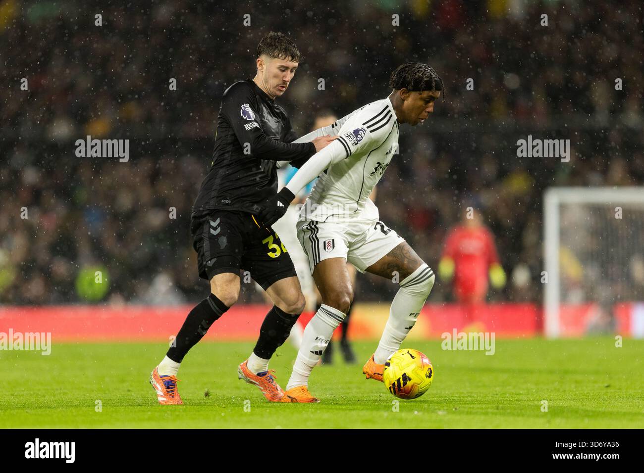Kevin of Fulham on the ball pressed by Trai Hume of Sunderland during ...