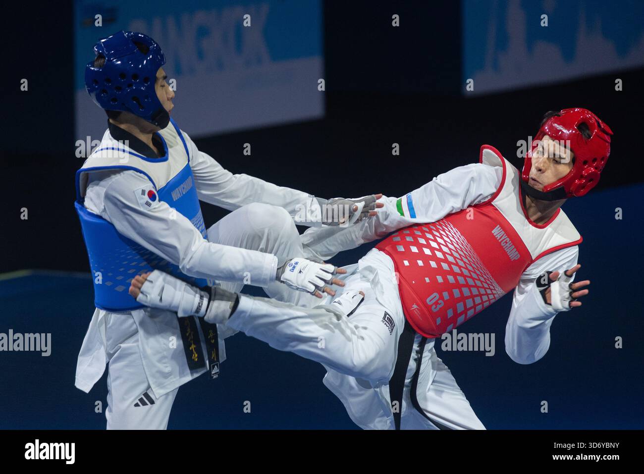 Bae Jun-Seo from South Korea (Blue) and Omonjon Otajonov from ...