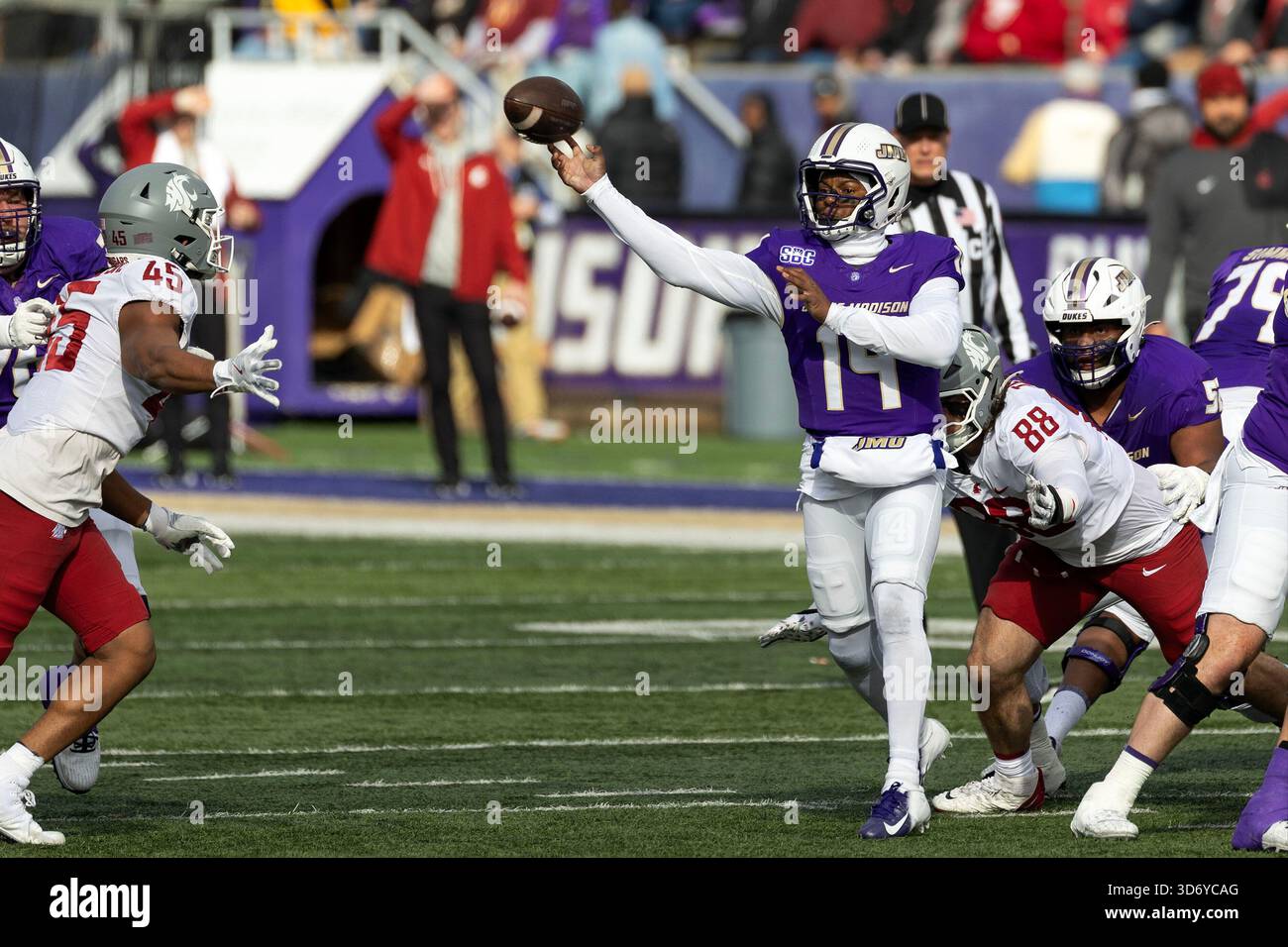 James Madison quarterback Alonza Barnett III (14) throws a pass under ...