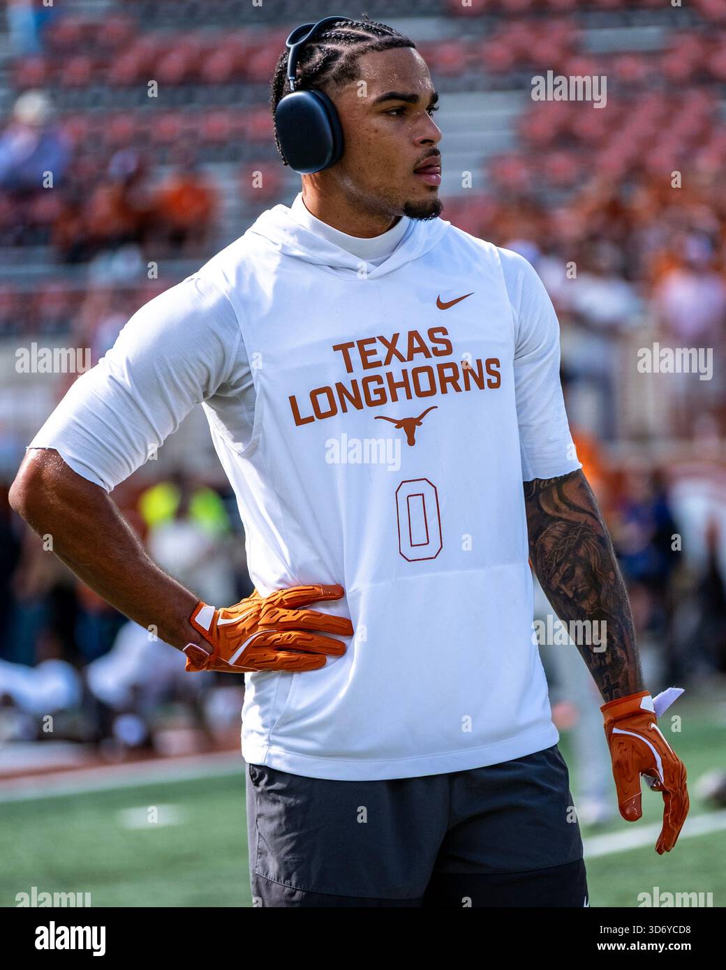 Nov 22, 2025. DeAndre Moore Jr (0) of the Texas Longhorns warms up ...