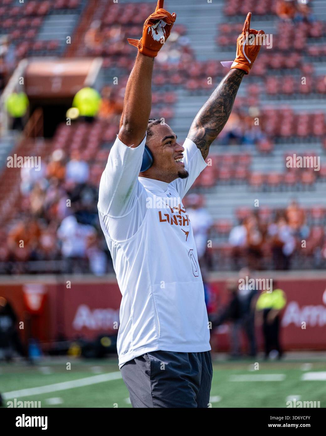 Nov 22, 2025. DeAndre Moore Jr (0) of the Texas Longhorns warms up ...